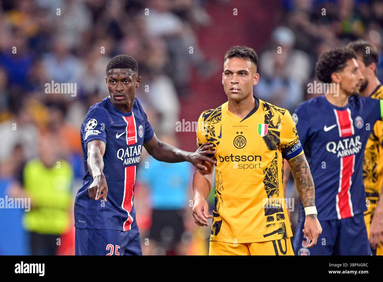 Munich, Germany. 31st, May 2025. Nuno Mendes (25) of Paris Saint-Germain and Lautaro Martinez ...