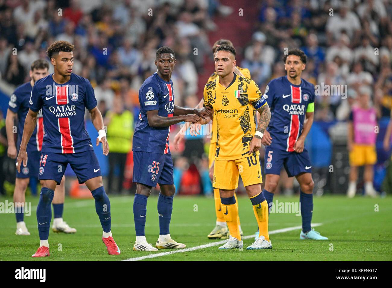 Munich, Germany. 31st, May 2025. Nuno Mendes (25) of Paris Saint-Germain and Lautaro Martinez ...