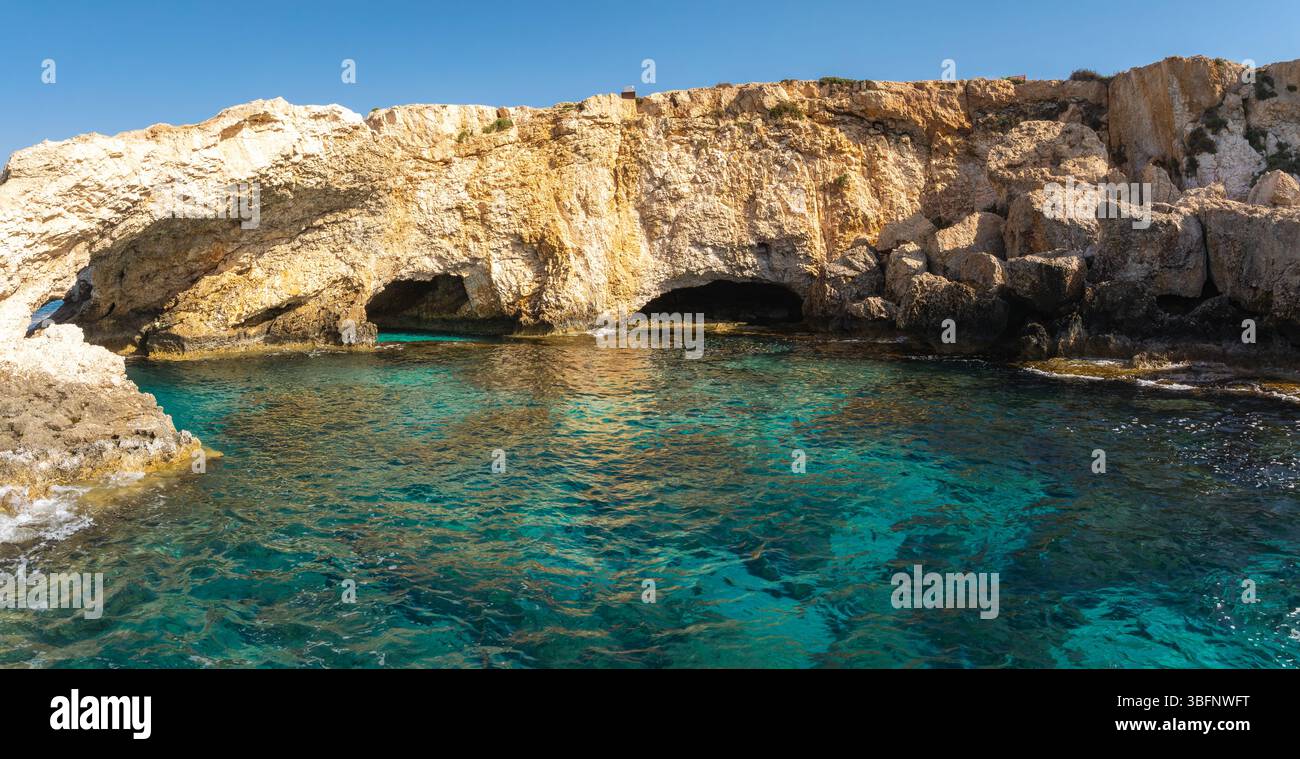 Rugged limestone cliffs with natural sea caves near Ayia Napa, Cyprus ...