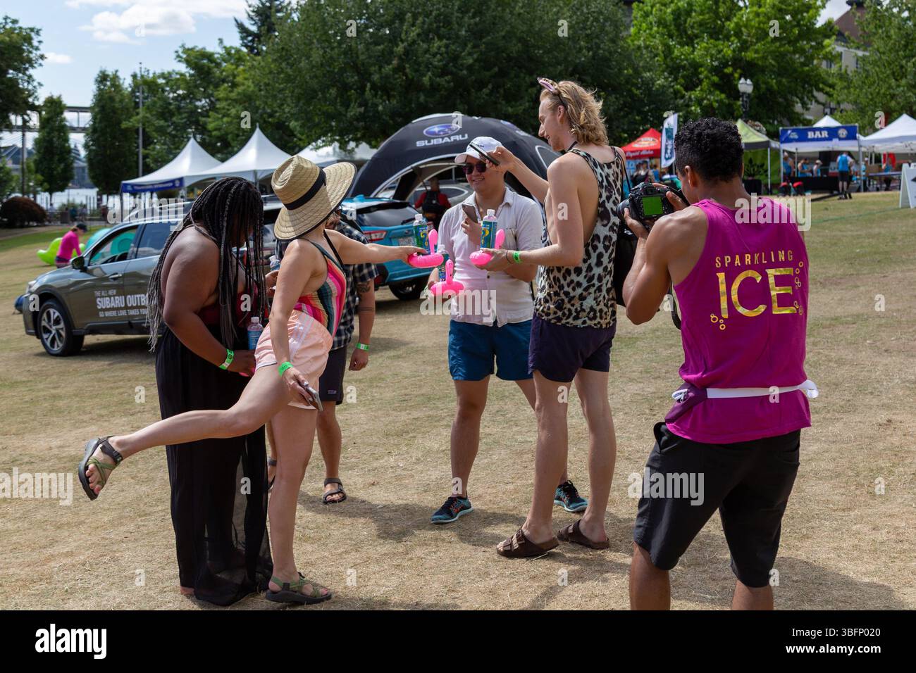The Big Float, Portland, Oregon - July 13th 2019: People pose with pink ...
