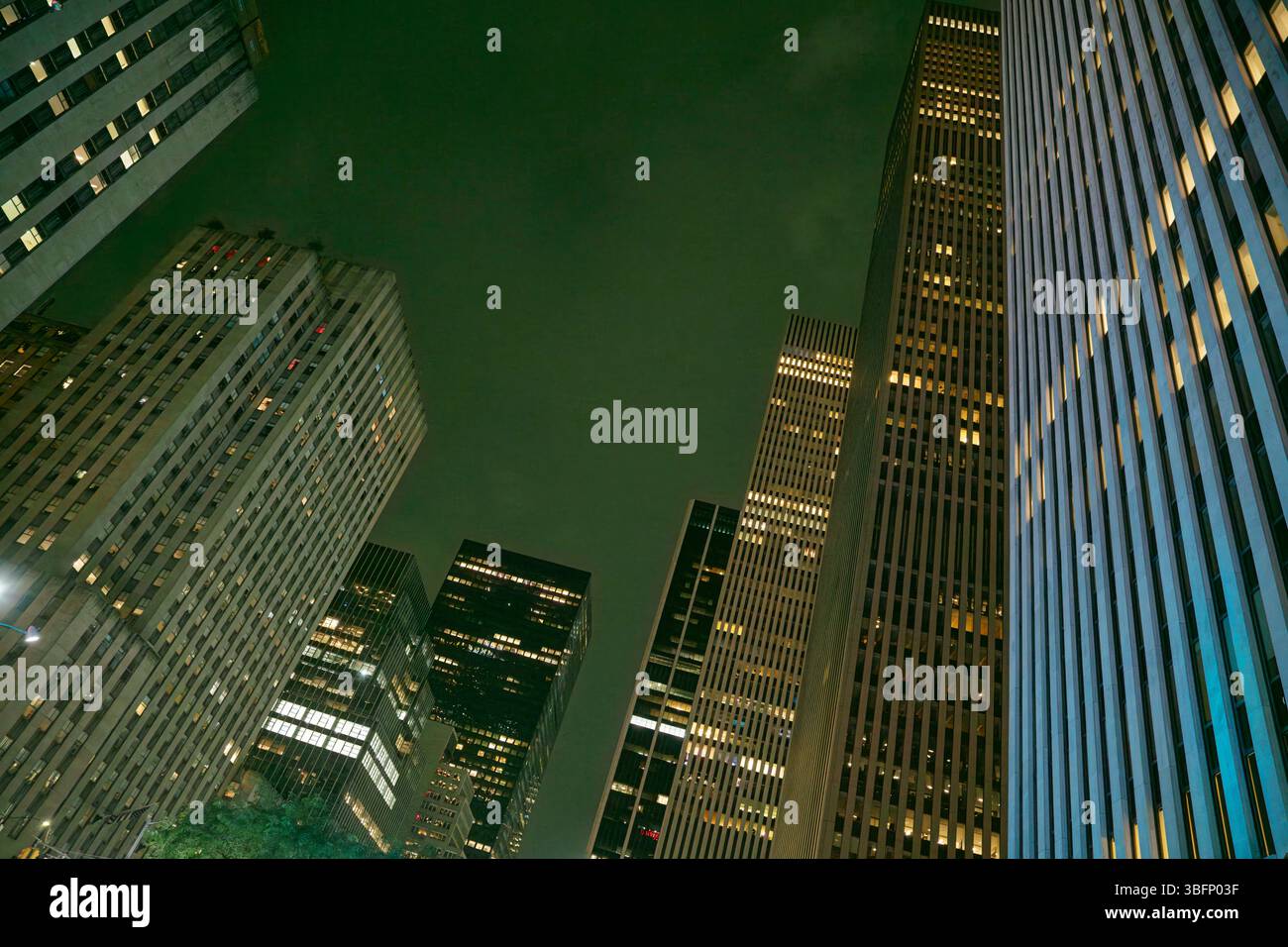 In the heart of Manhattan, towering skyscrapers reach for the night sky ...