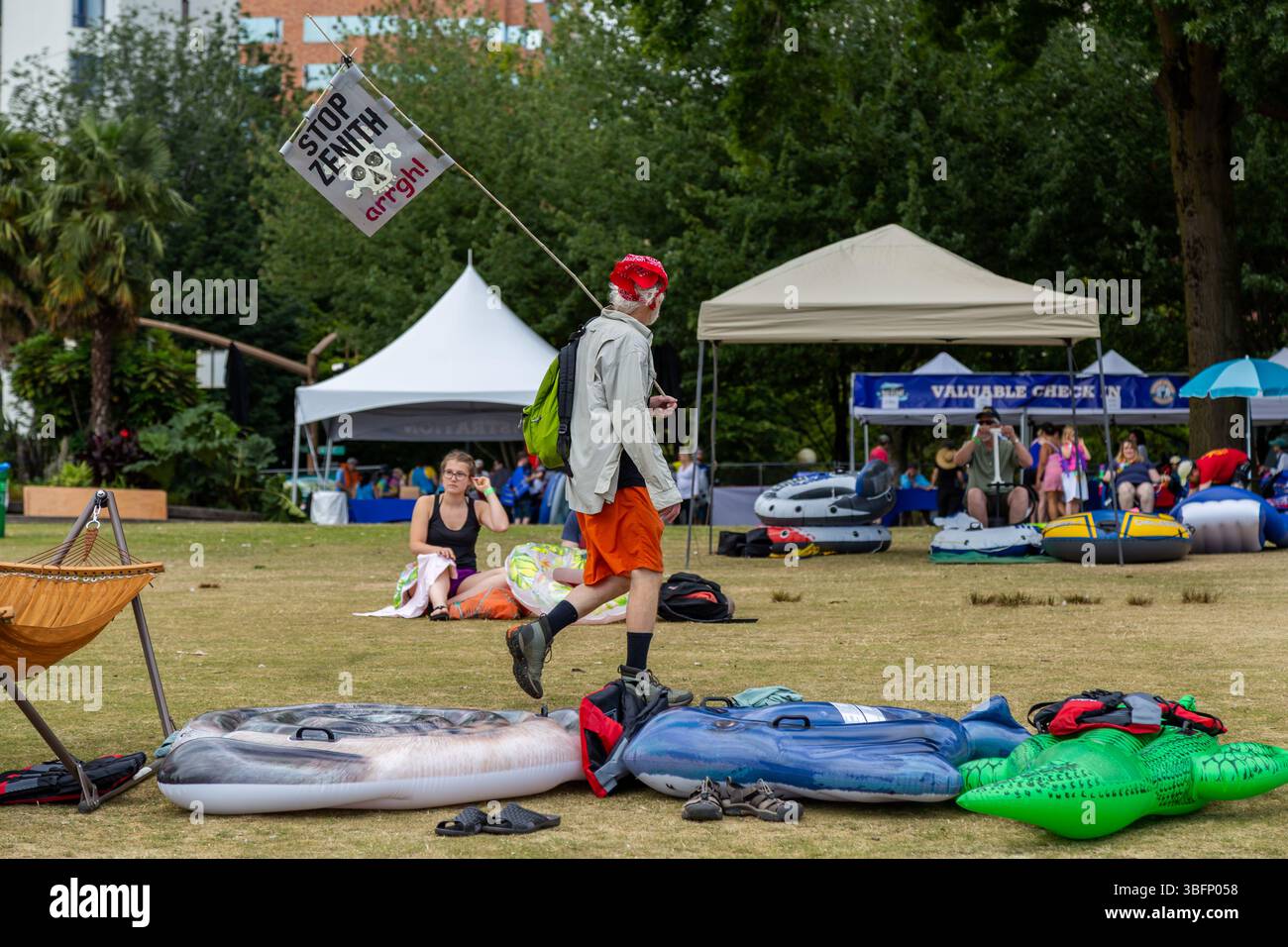 The Big Float, Portland, Oregon - July 13th 2019: A man walks with a ...