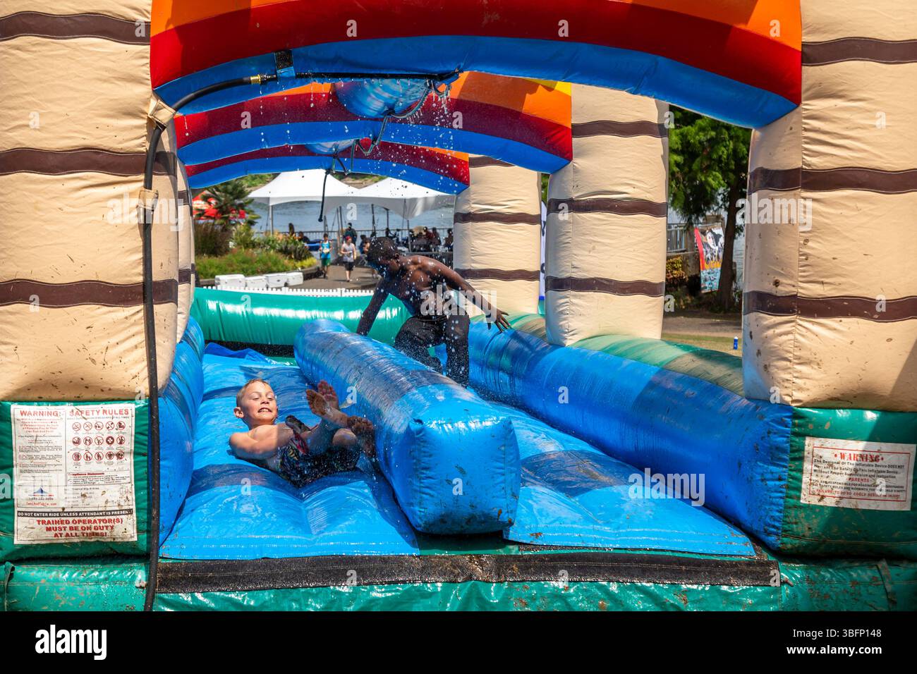The Big Float, Portland, Oregon - July 13th 2019: A boy slides down a ...