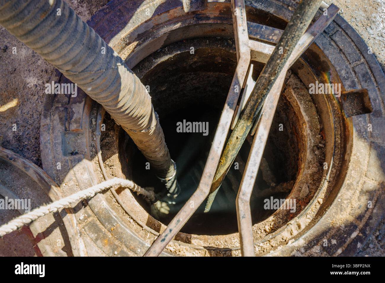 Process of cleaning up sewage collector. Pumping out household septic ...