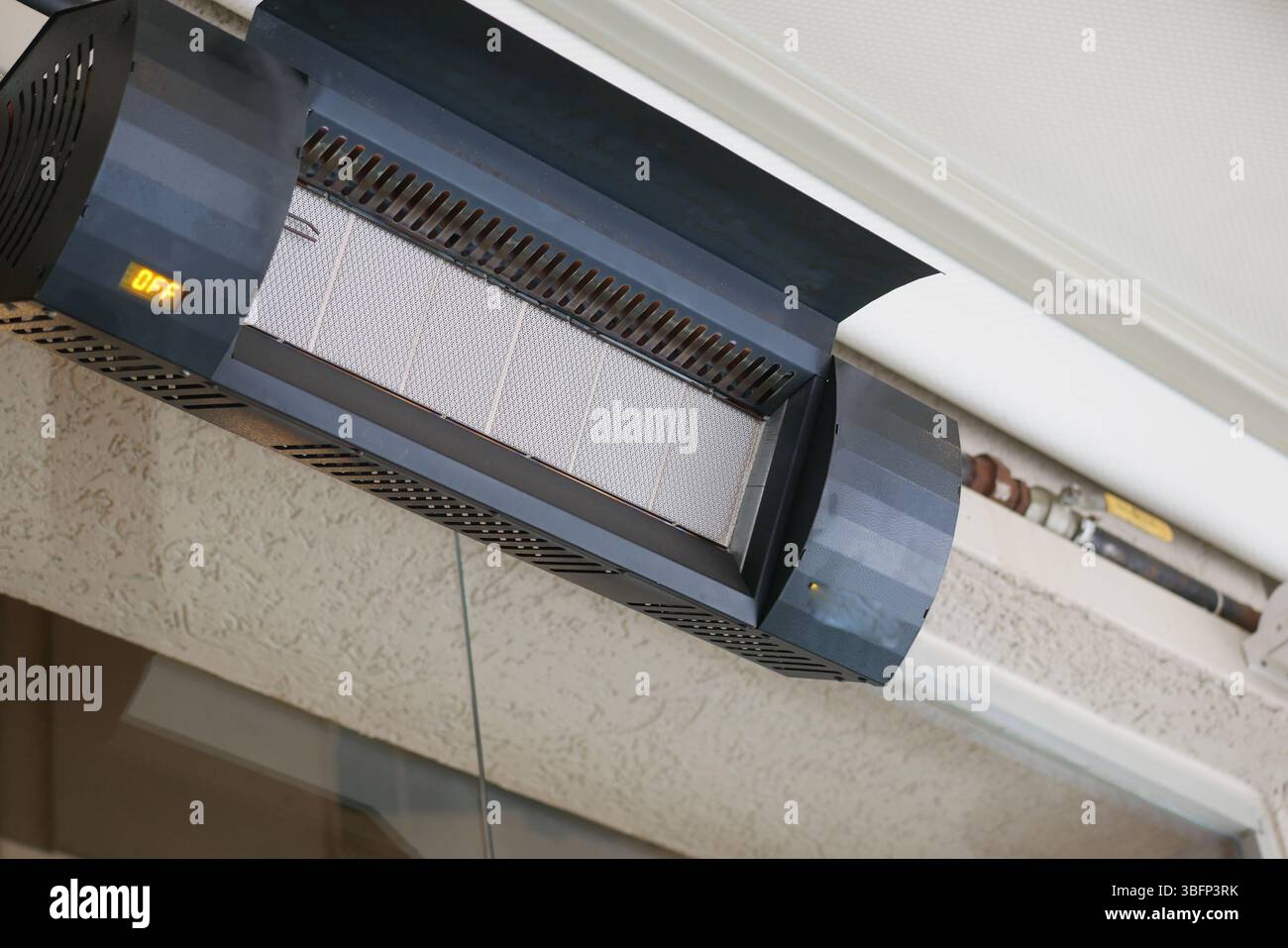 Wall-mounted heating unit installed in modern living space Stock Photo ...
