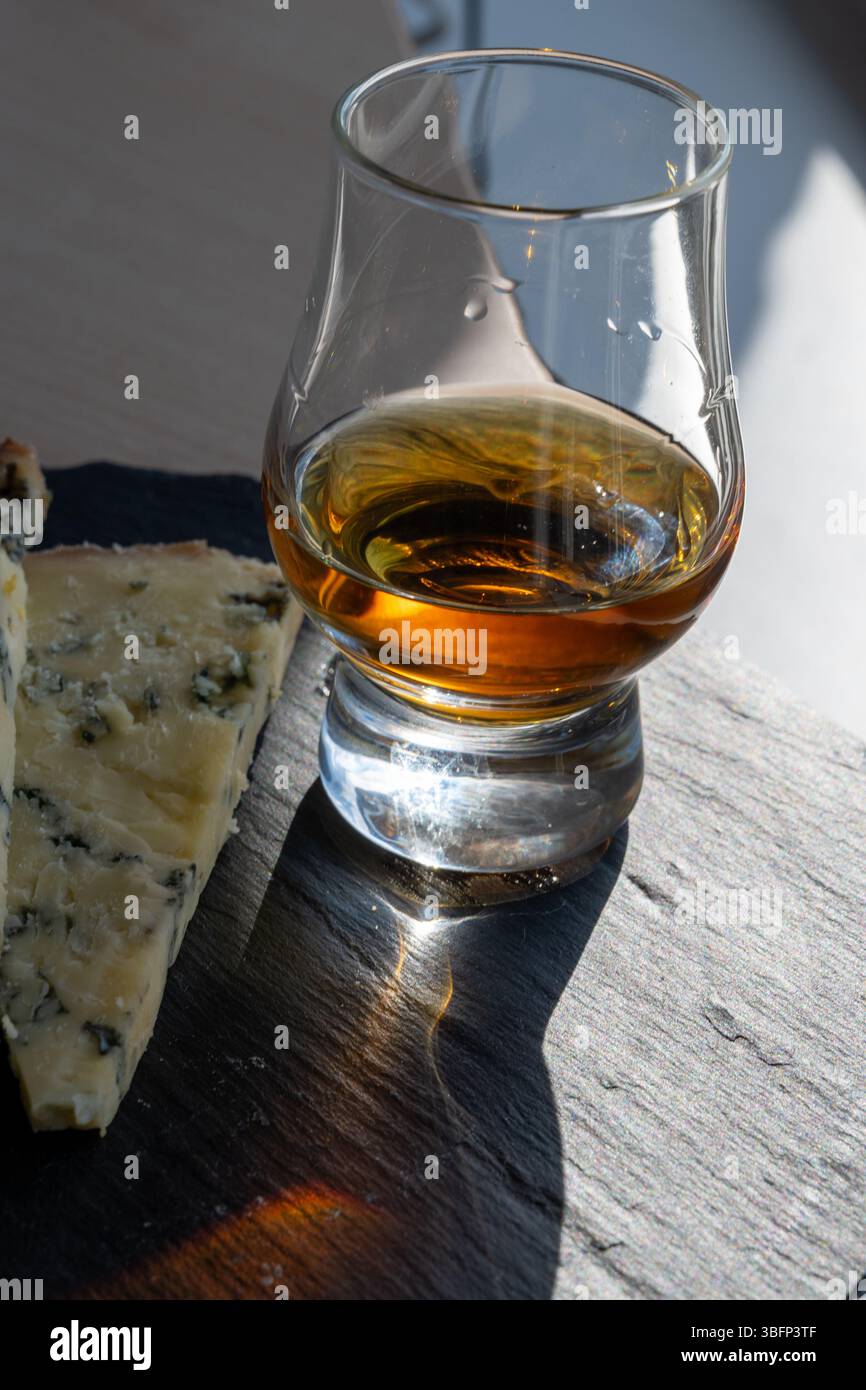 Whiskey and cheese pairing, tasting scotch whisky glass and plate with ...