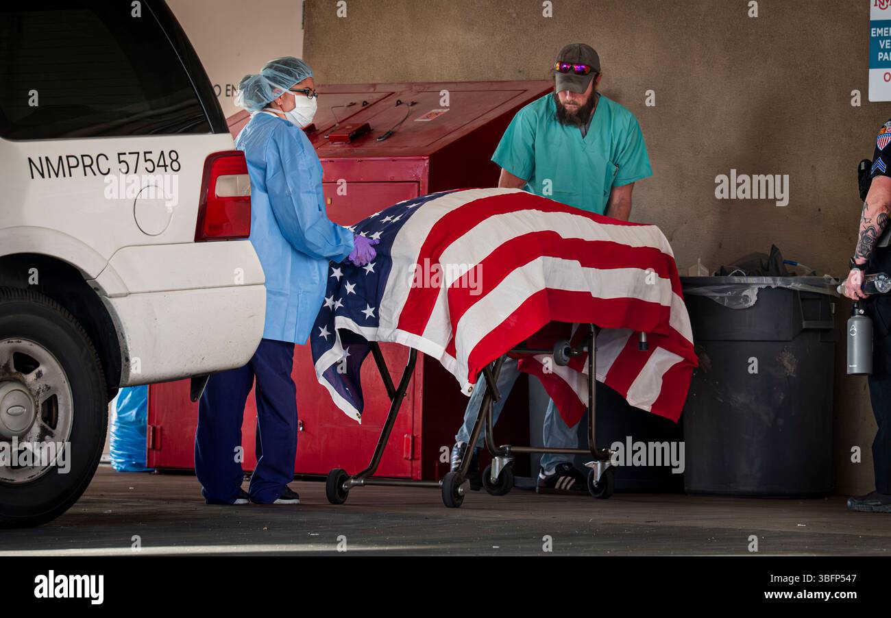 Medical staff load Bloomfield, New Mexico, police officer Timothy ...