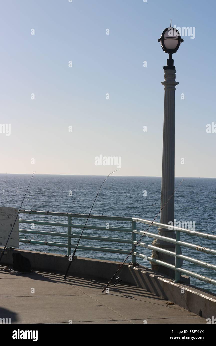 Three fishing Rods casting out into the Pacific Ocean on a clear ...