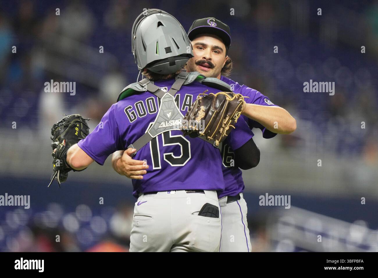 Colorado Rockies relief pitcher Zach Agnos, right, embraces catcher ...