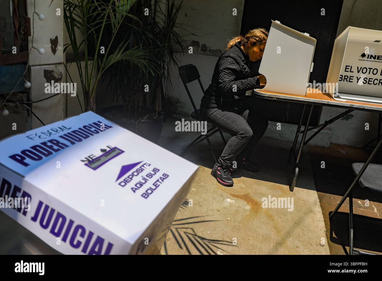 A Mexican citizen voting at polling station during the Judicial Branch ...