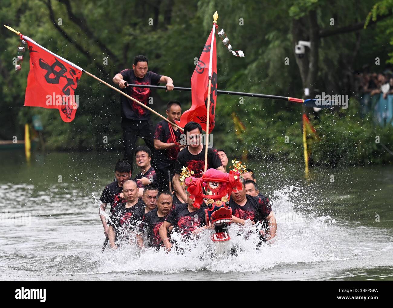 **CHINESE MAINLAND, HONG KONG, MACAU AND TAIWAN OUT** People row dragon ...