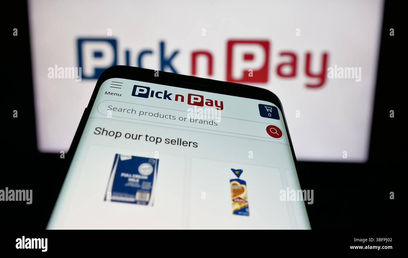 In this photo illustration, a mobile phone with the logo of grocery ...