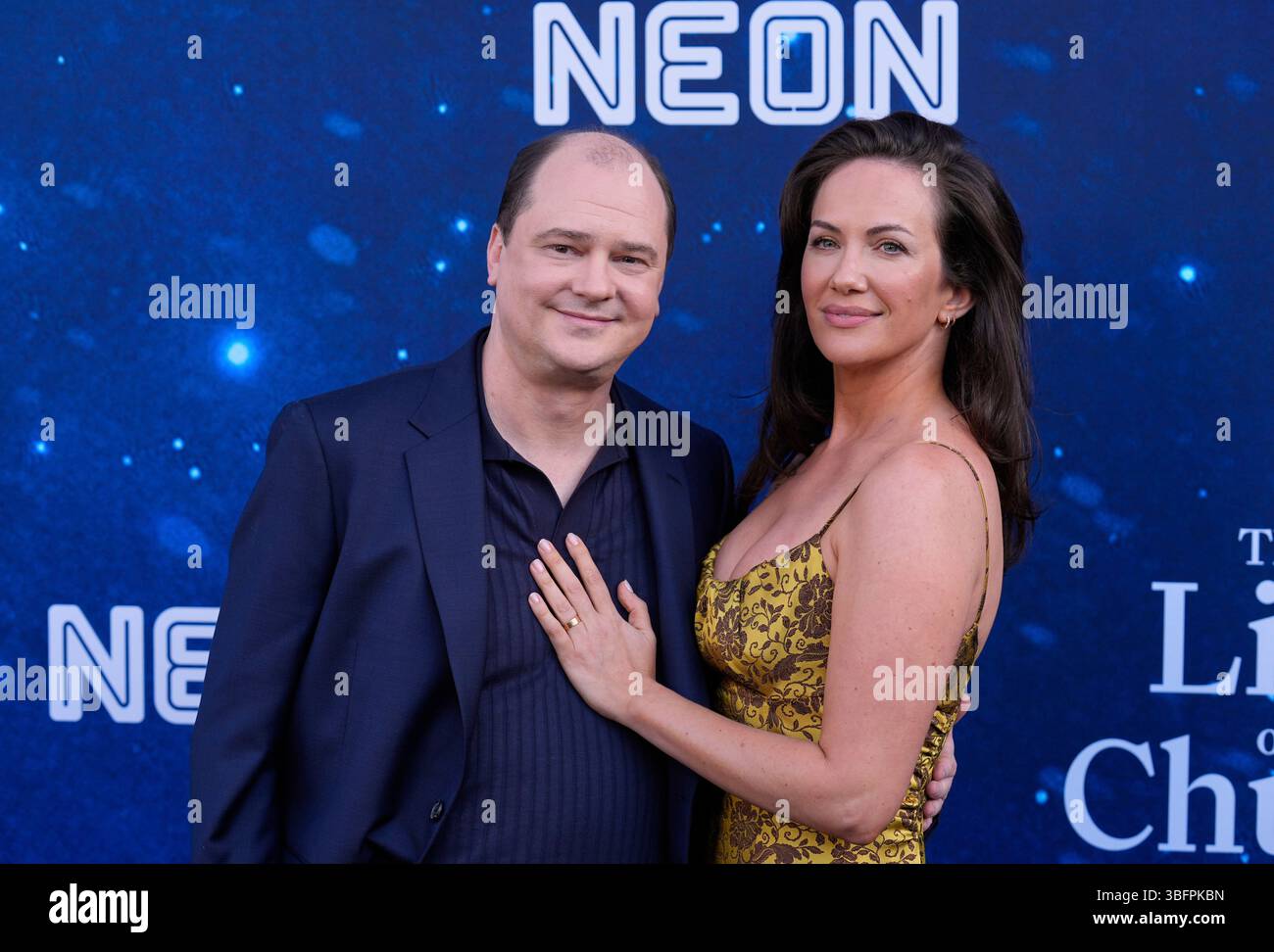 Mike Flanagan, left, writer/director of "The Life of Chuck," poses with his wife, cast member ...