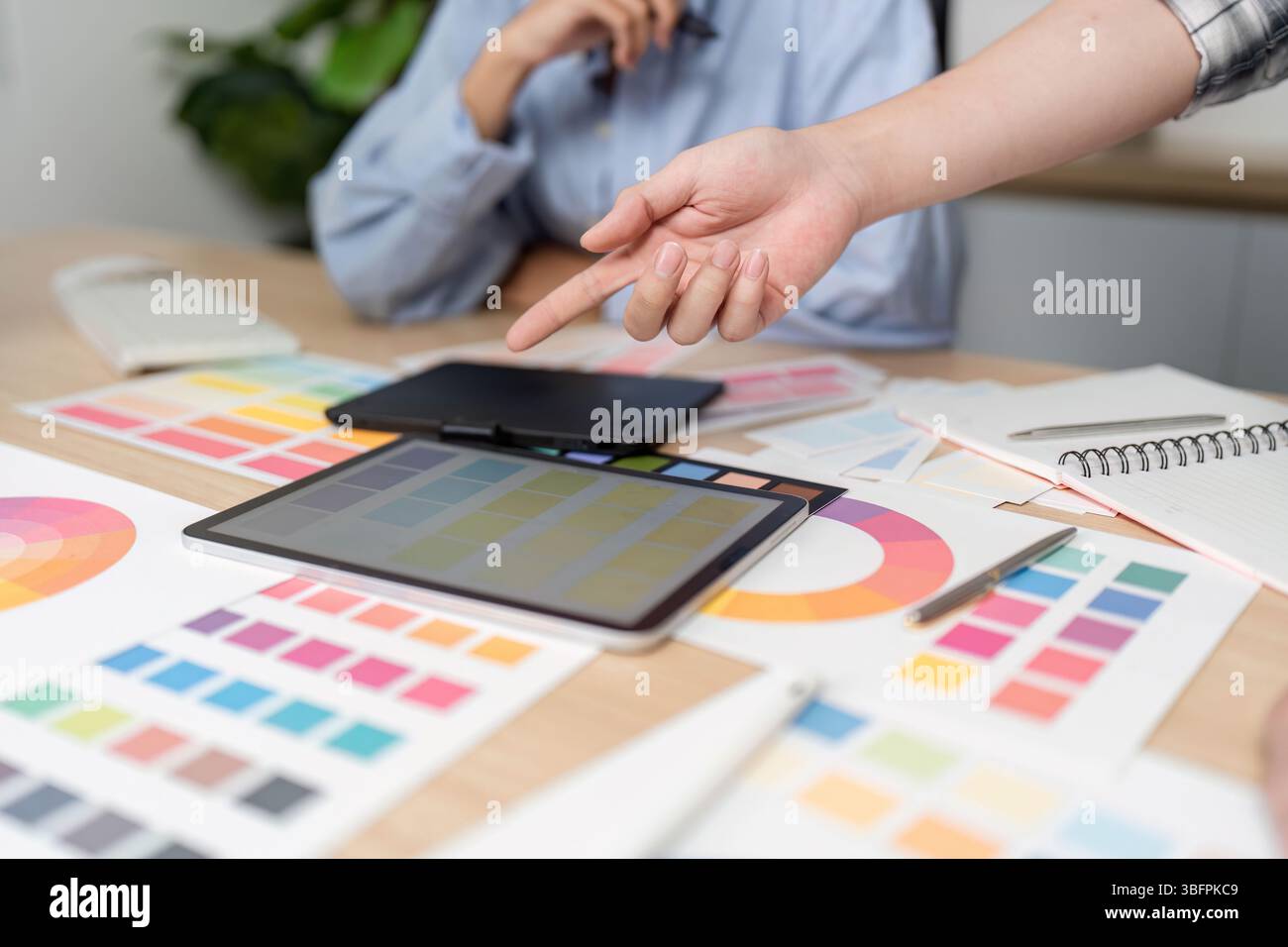 UX and UI Design Collaboration. Creative team discussing color palettes ...