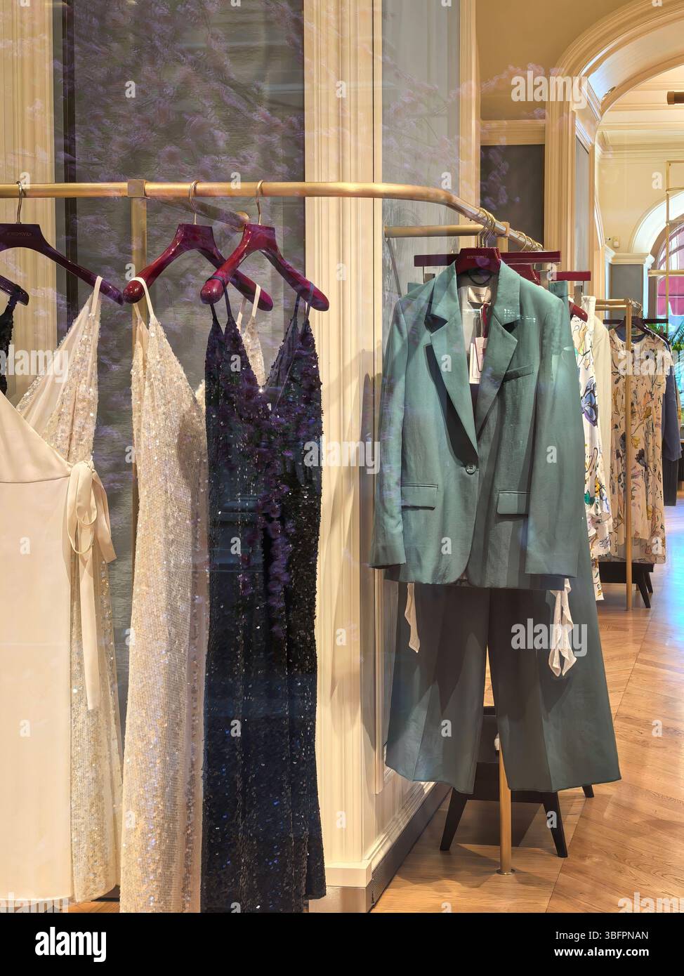 Moscow, Russia - May 27, 2025. Elegant Dresses and Suits Displayed in ...