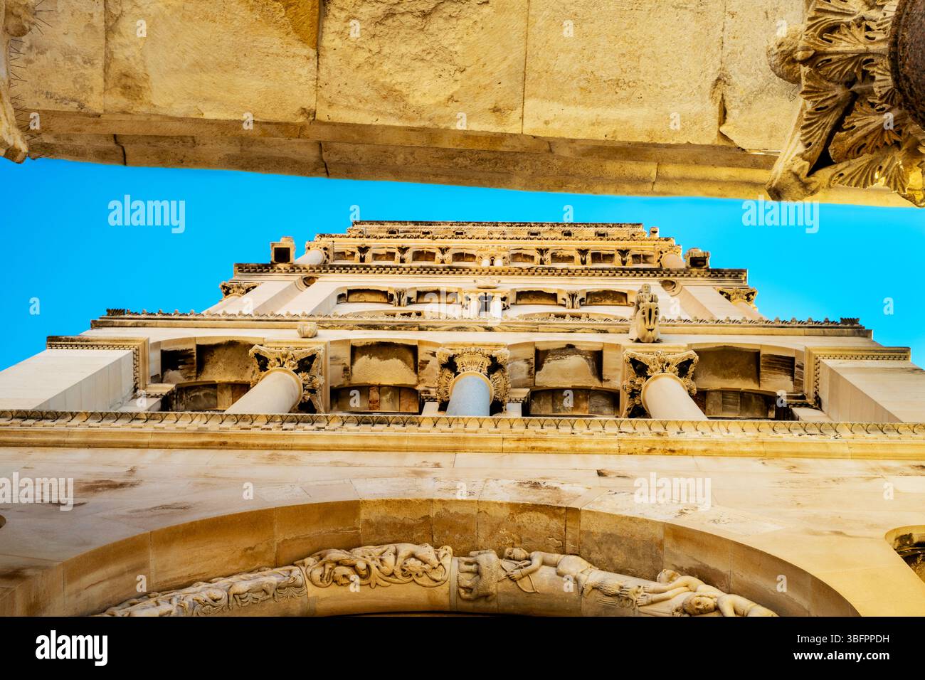 Unique carved figures on the arch of Romanesque bell tower in Split ...