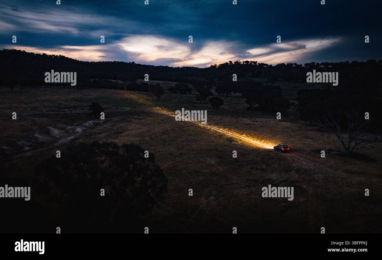farm tour at night, headlights illuminate the property Stock Photo - Alamy