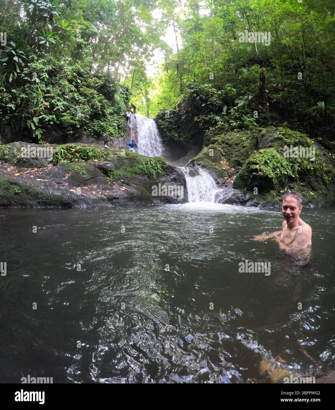 Tourist and locals at Mbopo waterfall, New Georgia, Solomon Islands. No ...