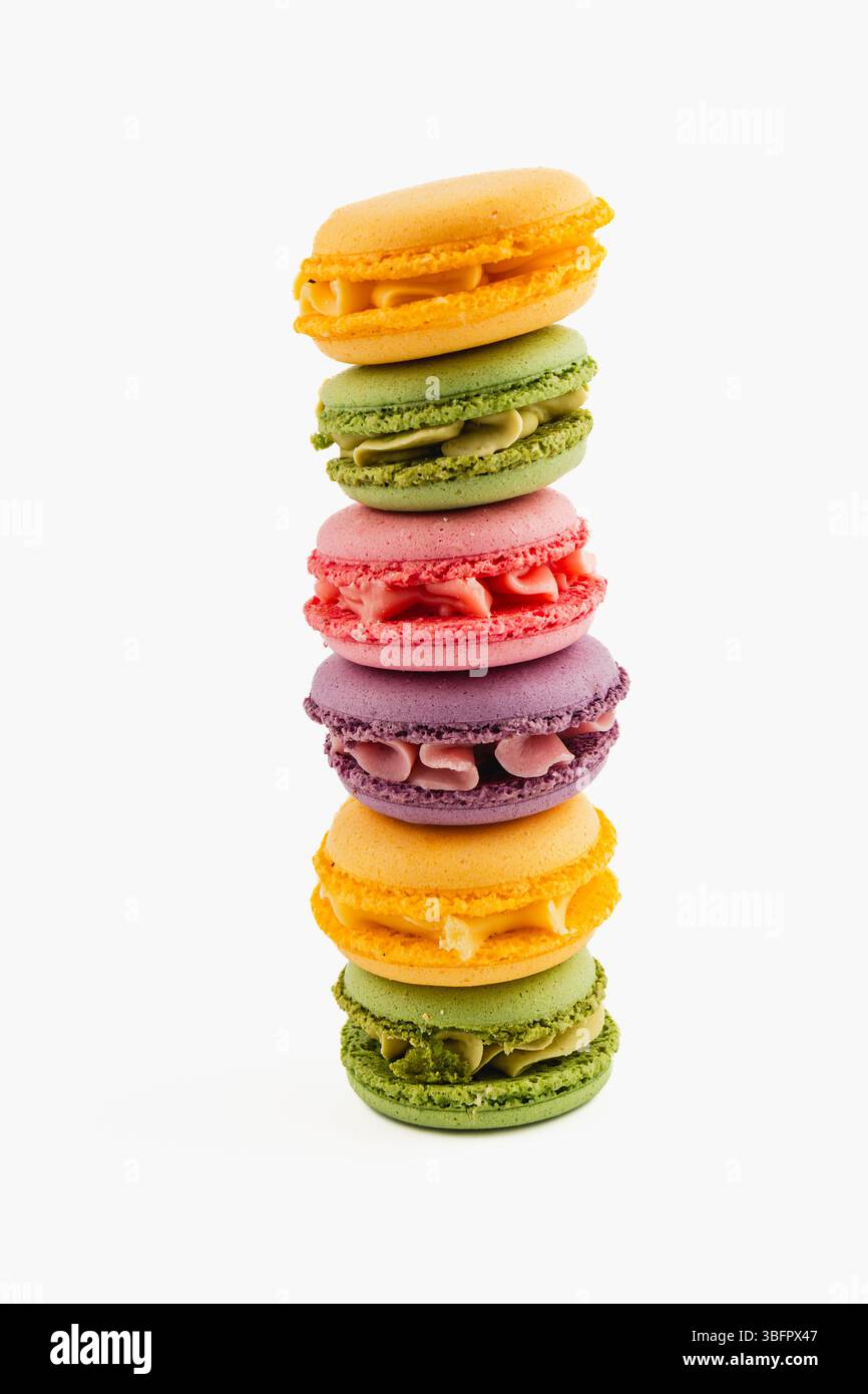 A vibrant stack of macarons in various flavors and colors, beautifully ...