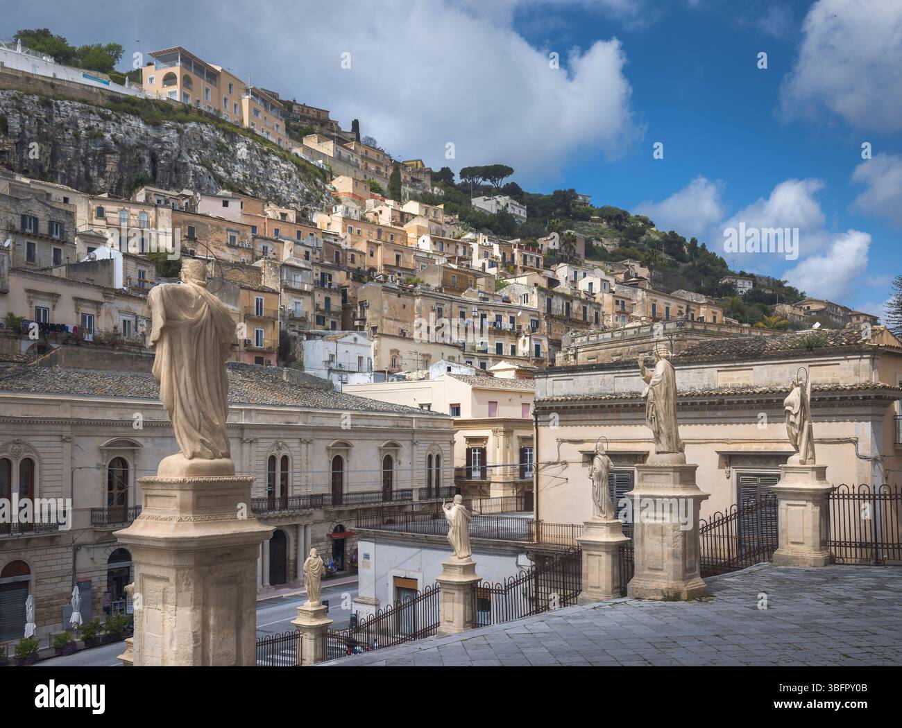 Marble figures guard Modica's charming buildings, highlighting the ...