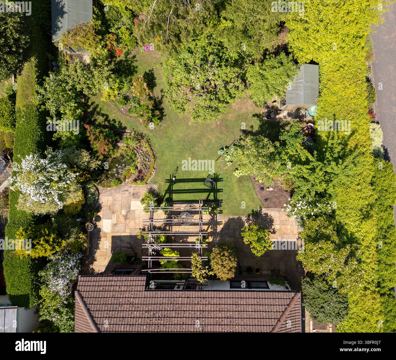 Aerial view of a back garden and patio of an English house, England ...