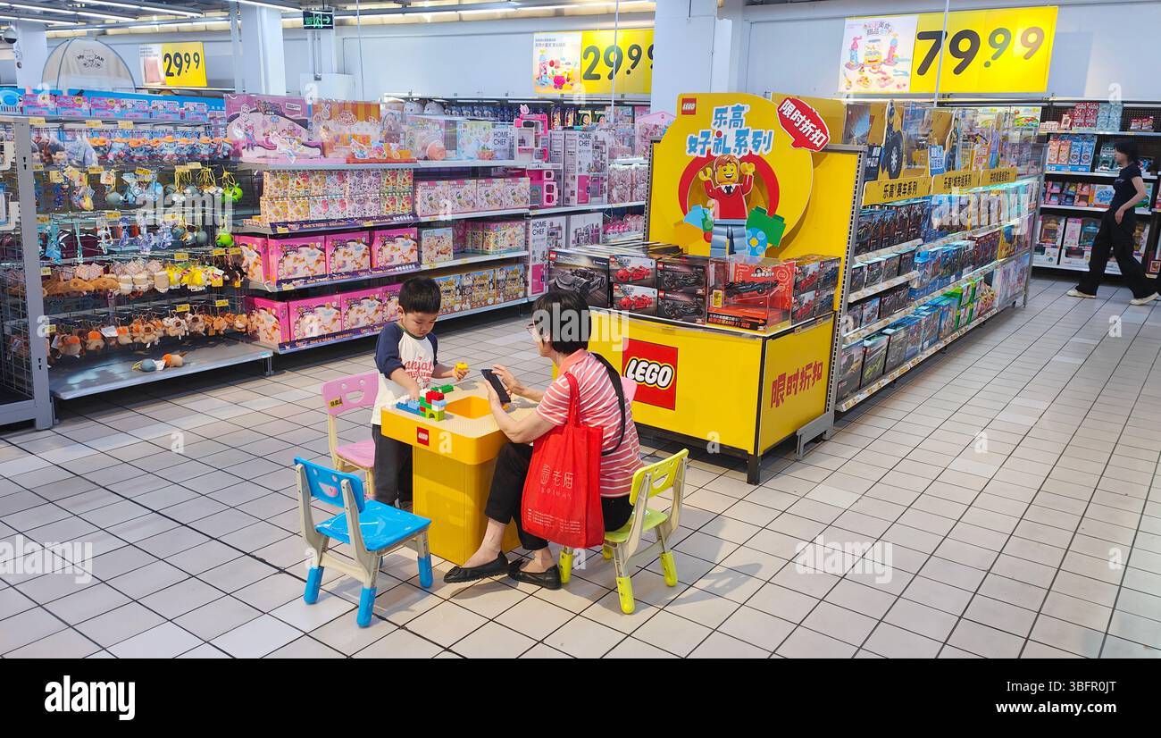 Customers shop at a Walmart supermarket in Shanghai, China on May 30 ...