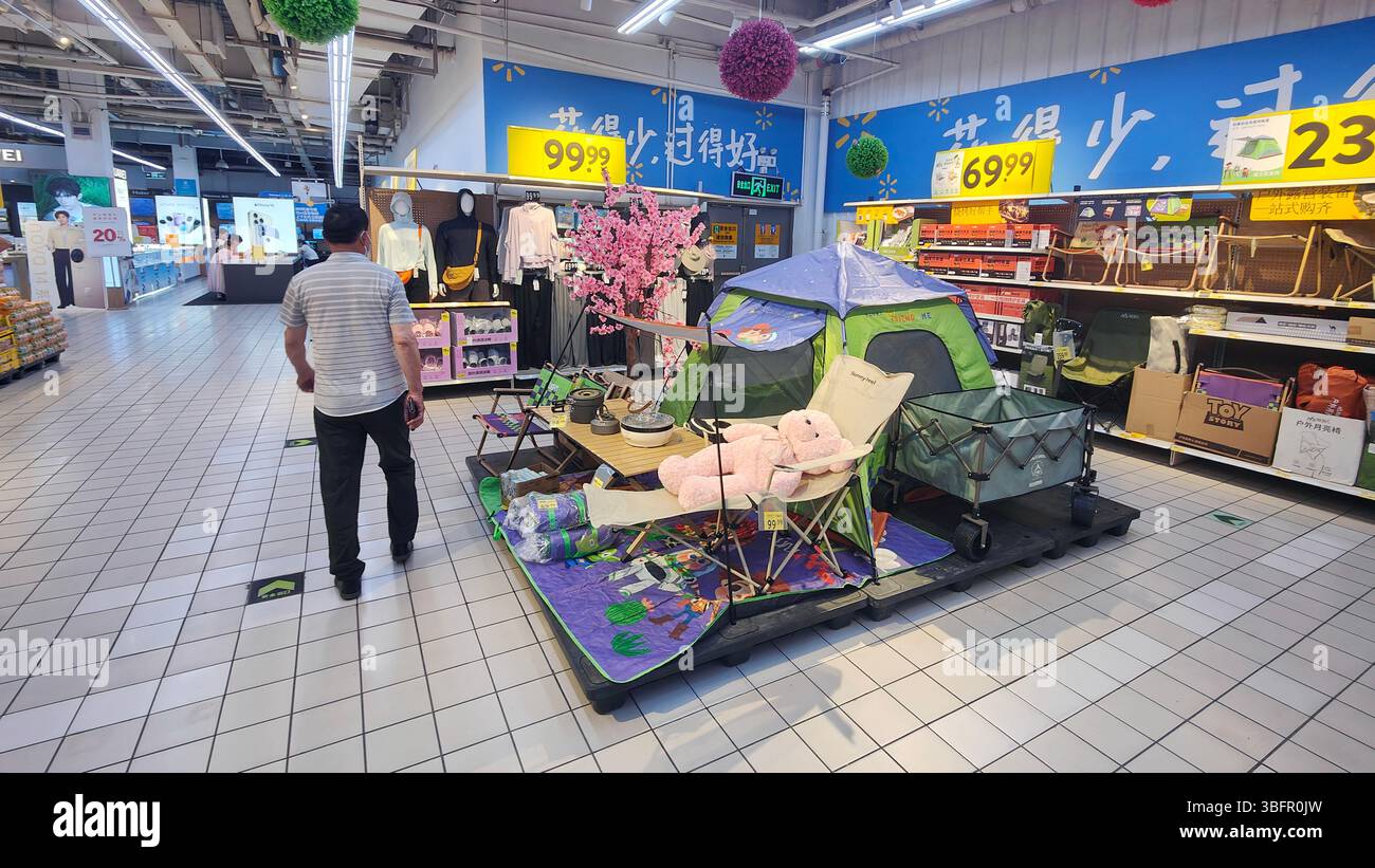 Customers shop at a Walmart supermarket in Shanghai, China on May 30 ...