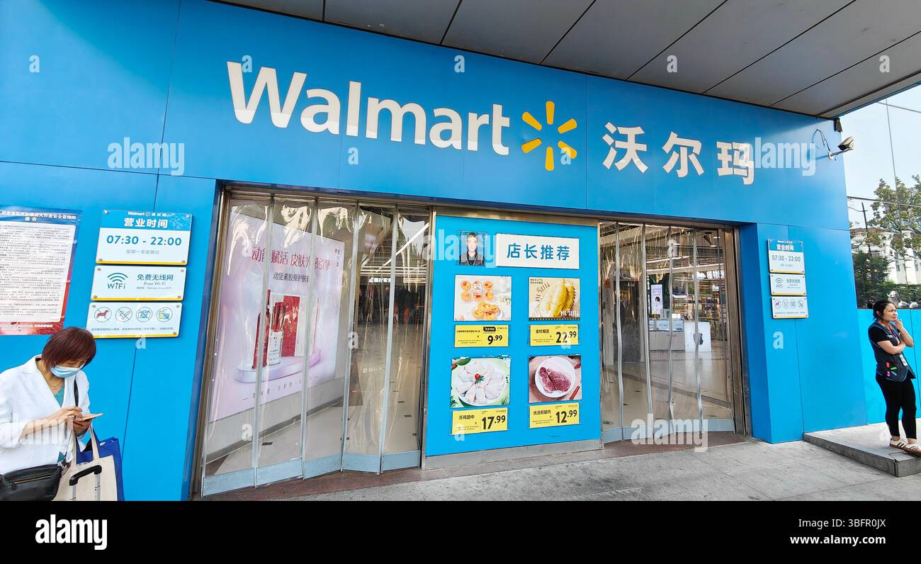 Customers shop at a Walmart supermarket in Shanghai, China on May 30 ...