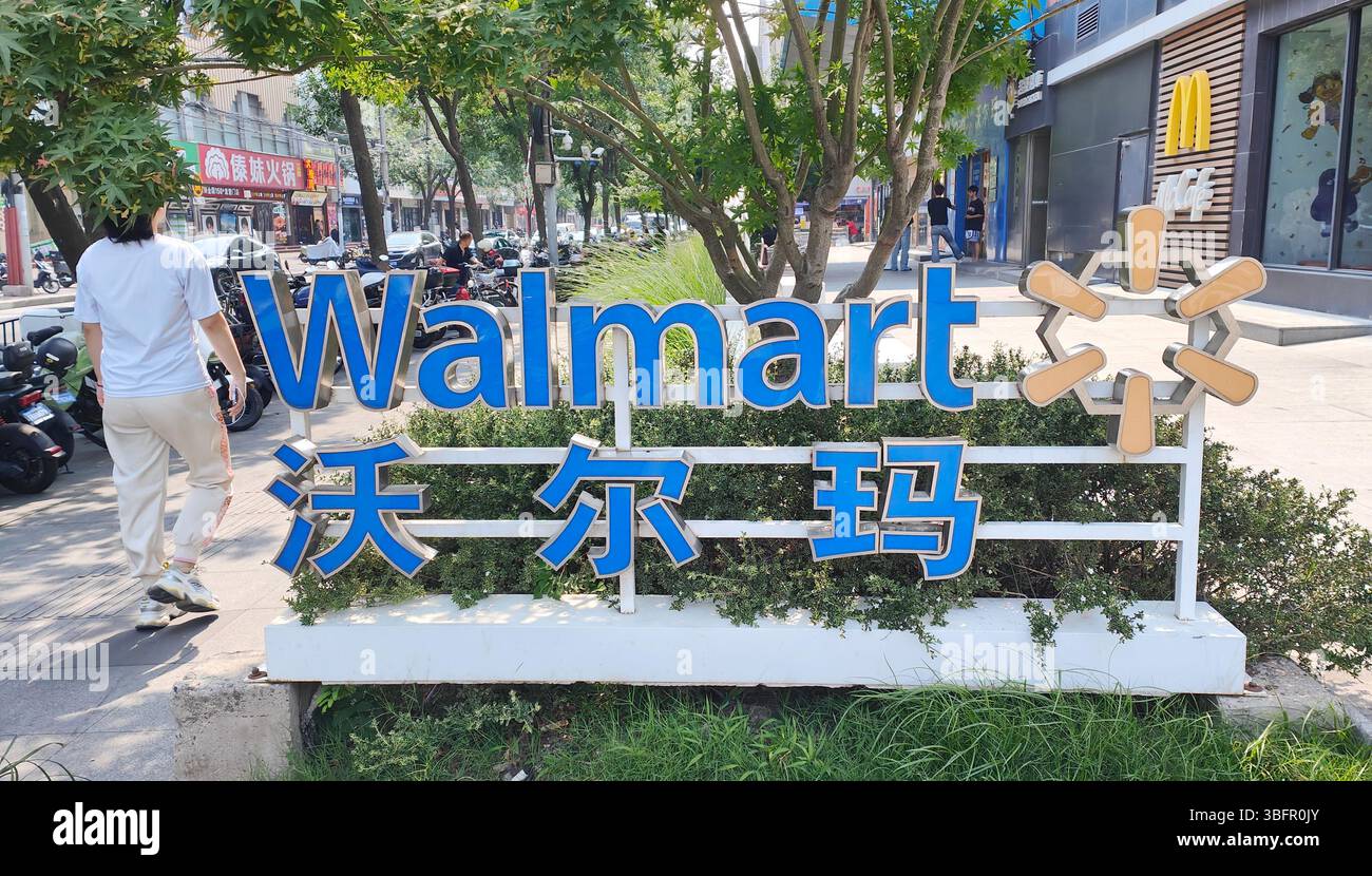 Customers shop at a Walmart supermarket in Shanghai, China on May 30 ...