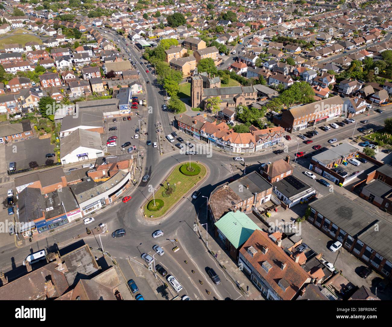 Church and roundabout, Moreton town, Wirral, Merseyside, England Stock ...