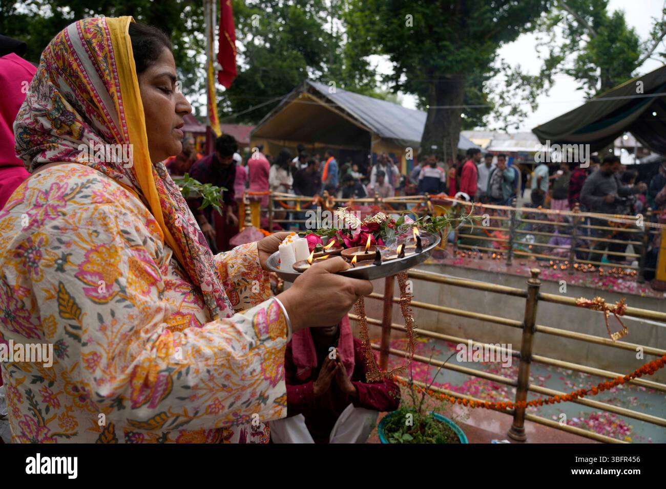 Hindu devotees pray during the annual festival at the Kheer Bhawani ...