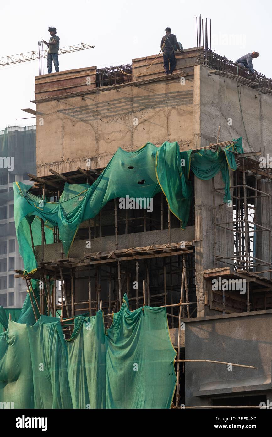 Mumbai, India - March 11 2023: Workers engaged in construction of a ...
