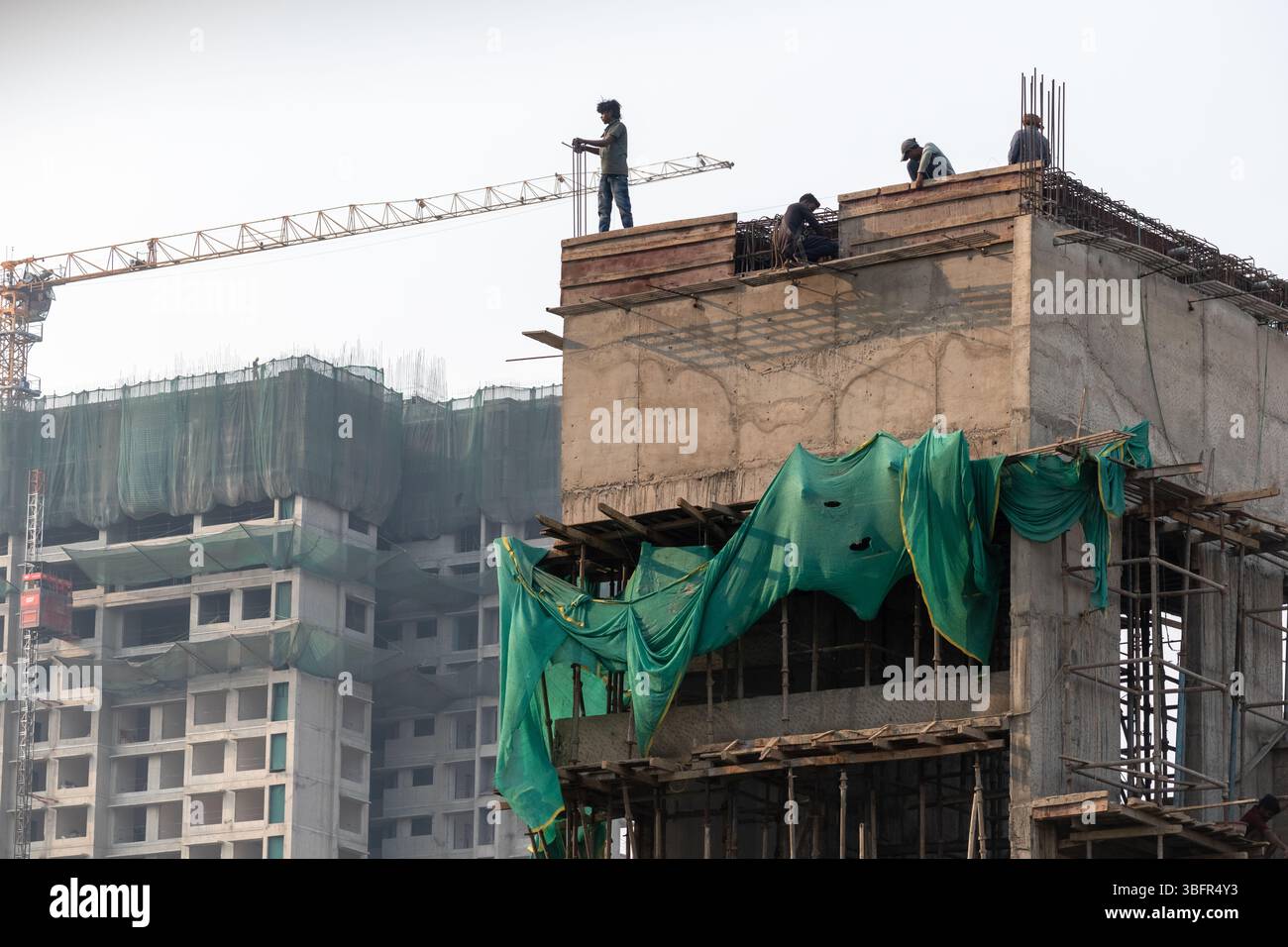 Mumbai, India - March 11 2023: Workers engaged in construction of a ...