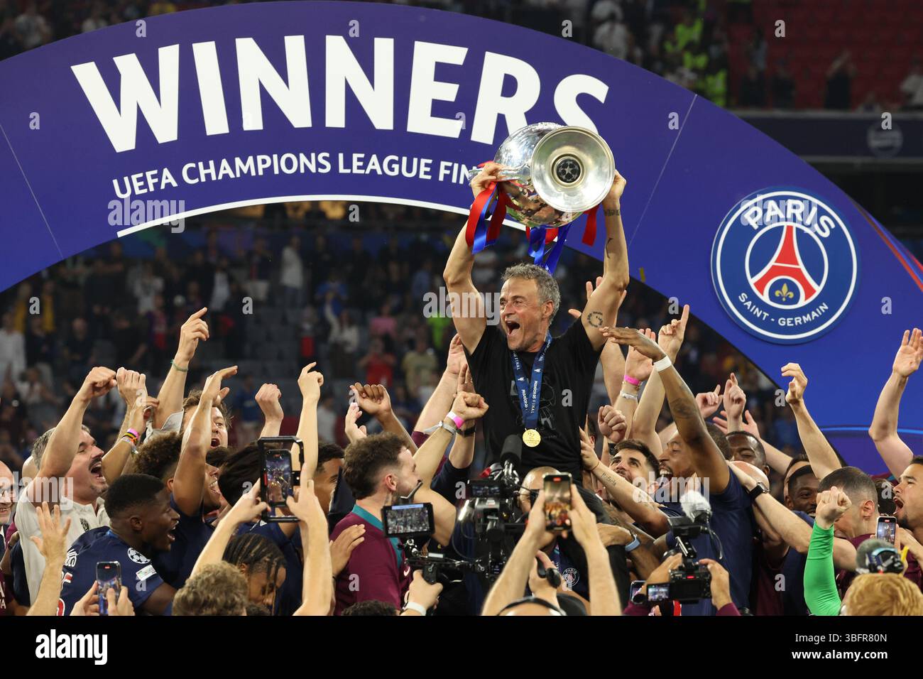 Munich, Germany May 31, 2025: Louis Enrique Coach manager of PSG lift the cup in award cerimony ...