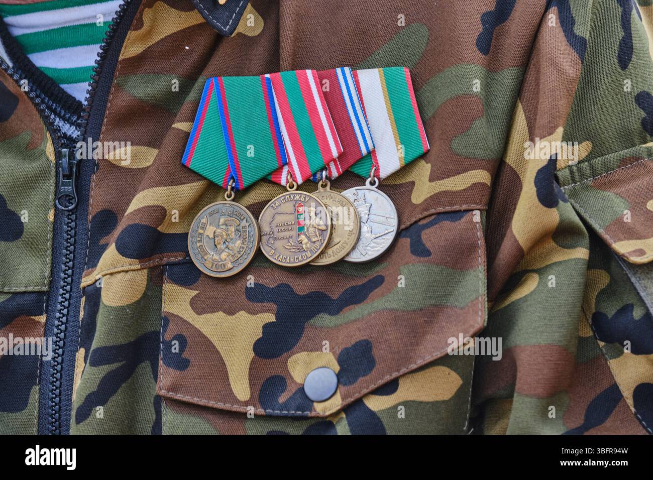 Jubilee medals of Russian and Soviet border troops on chest of former ...