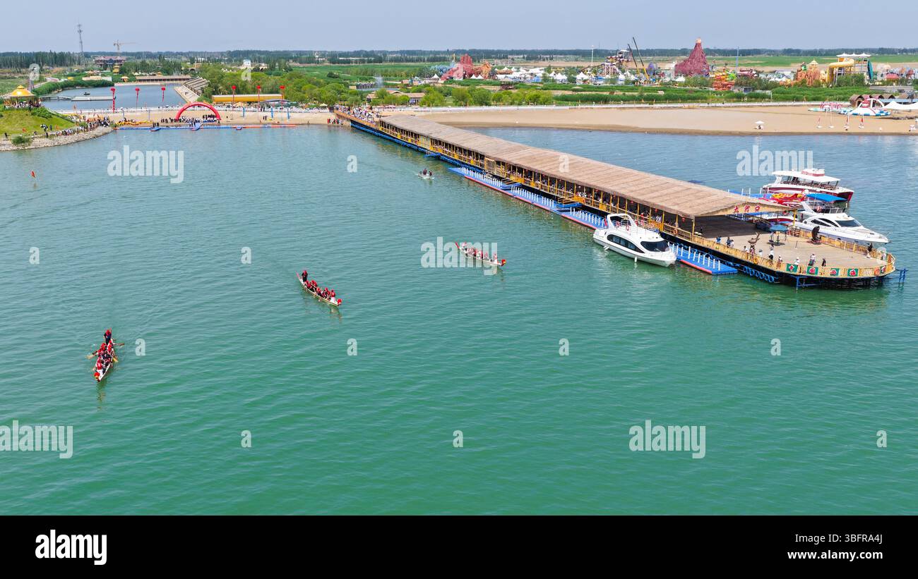 People take part in a dragon boat race at Bosten Lake scenic area in ...