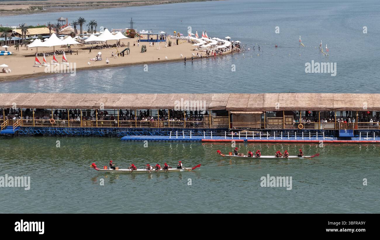 People take part in a dragon boat race at Bosten Lake scenic area in ...