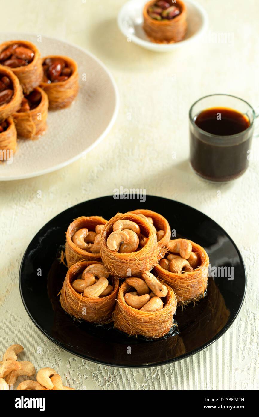 Cashew rolls (Asawer), Arabic pastries sweetened with syrup, filled ...