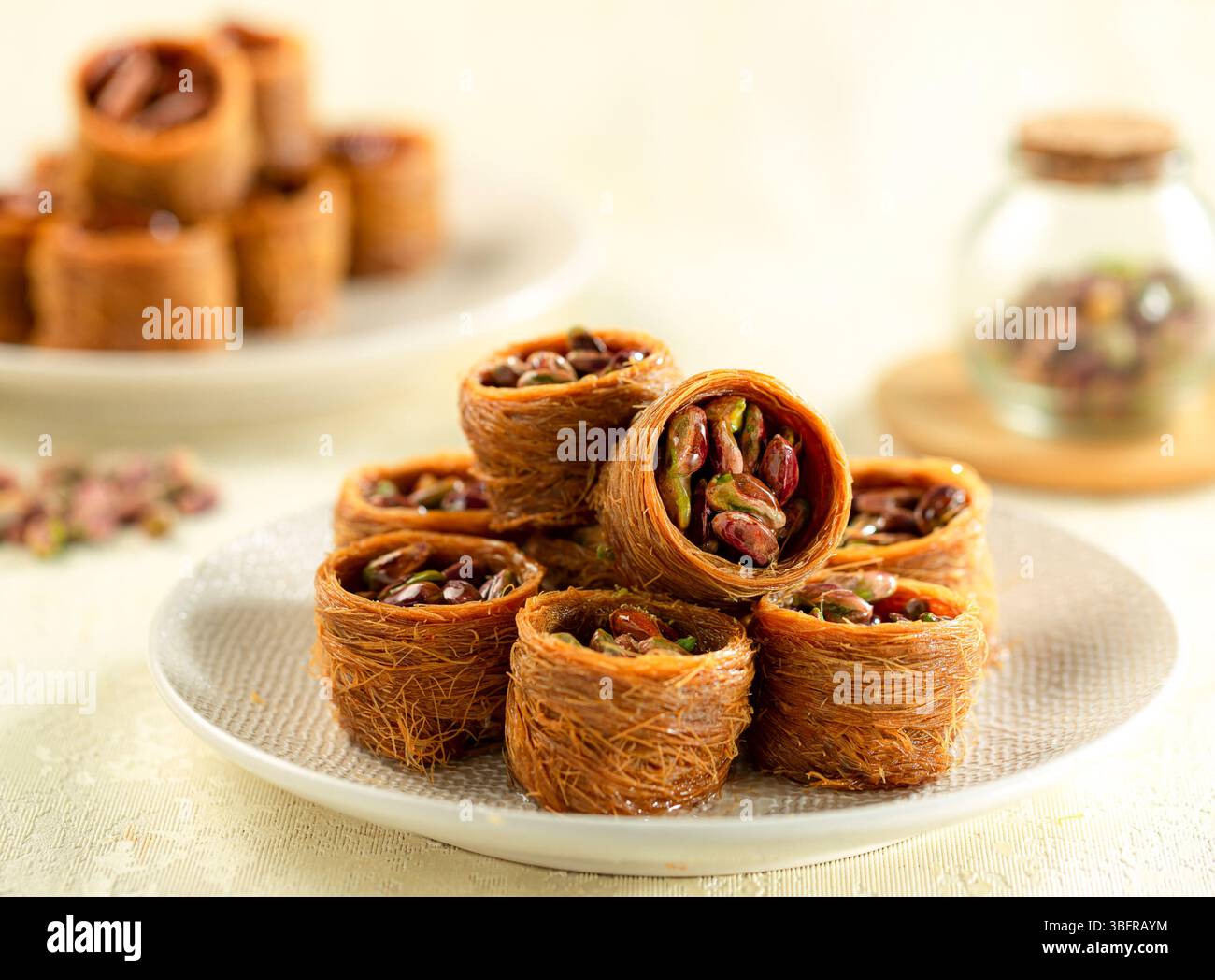 Arabic dessert assortment of baklava and nut rolls (Asawer) with syrup ...