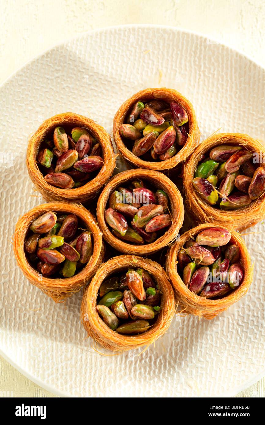 Top view of pistachio nut rolls, traditional Middle Eastern dessert ...