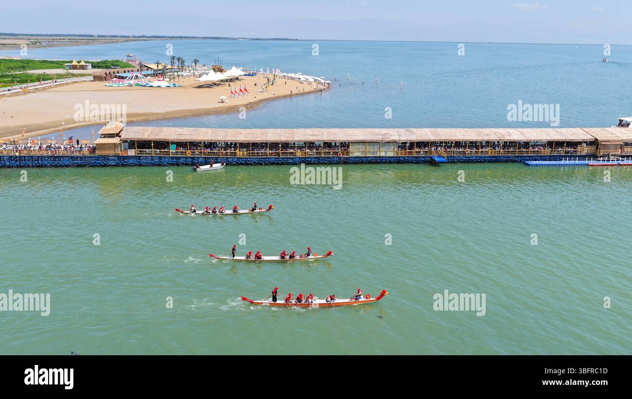 People take part in a dragon boat race at Bosten Lake scenic area in ...