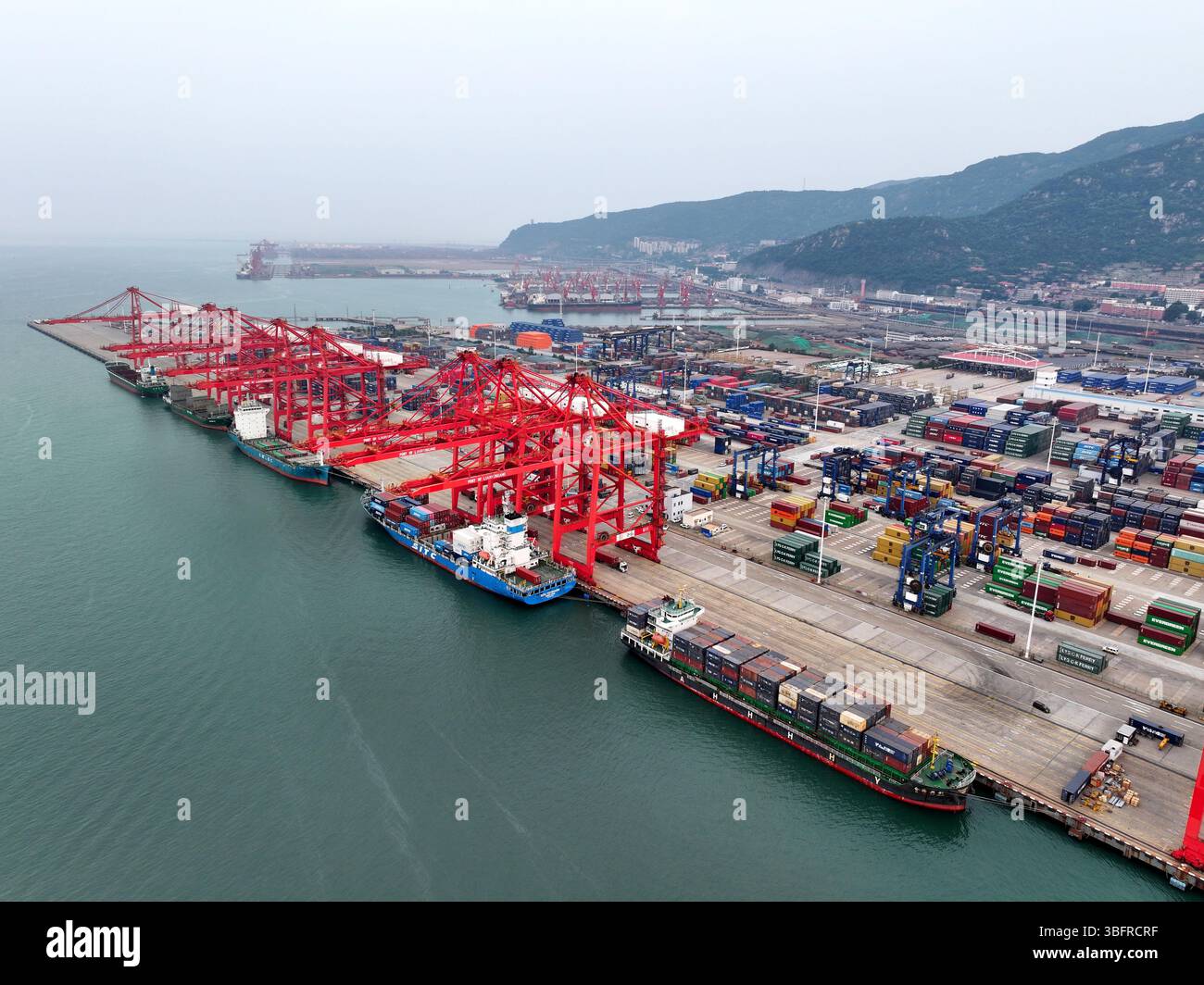 Aerial photo shows the container terminal of Lianyungang Port at night ...
