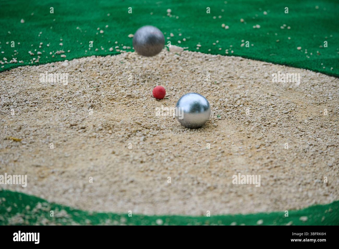Petanque precision shooting competition moment with metal balls hitting ...