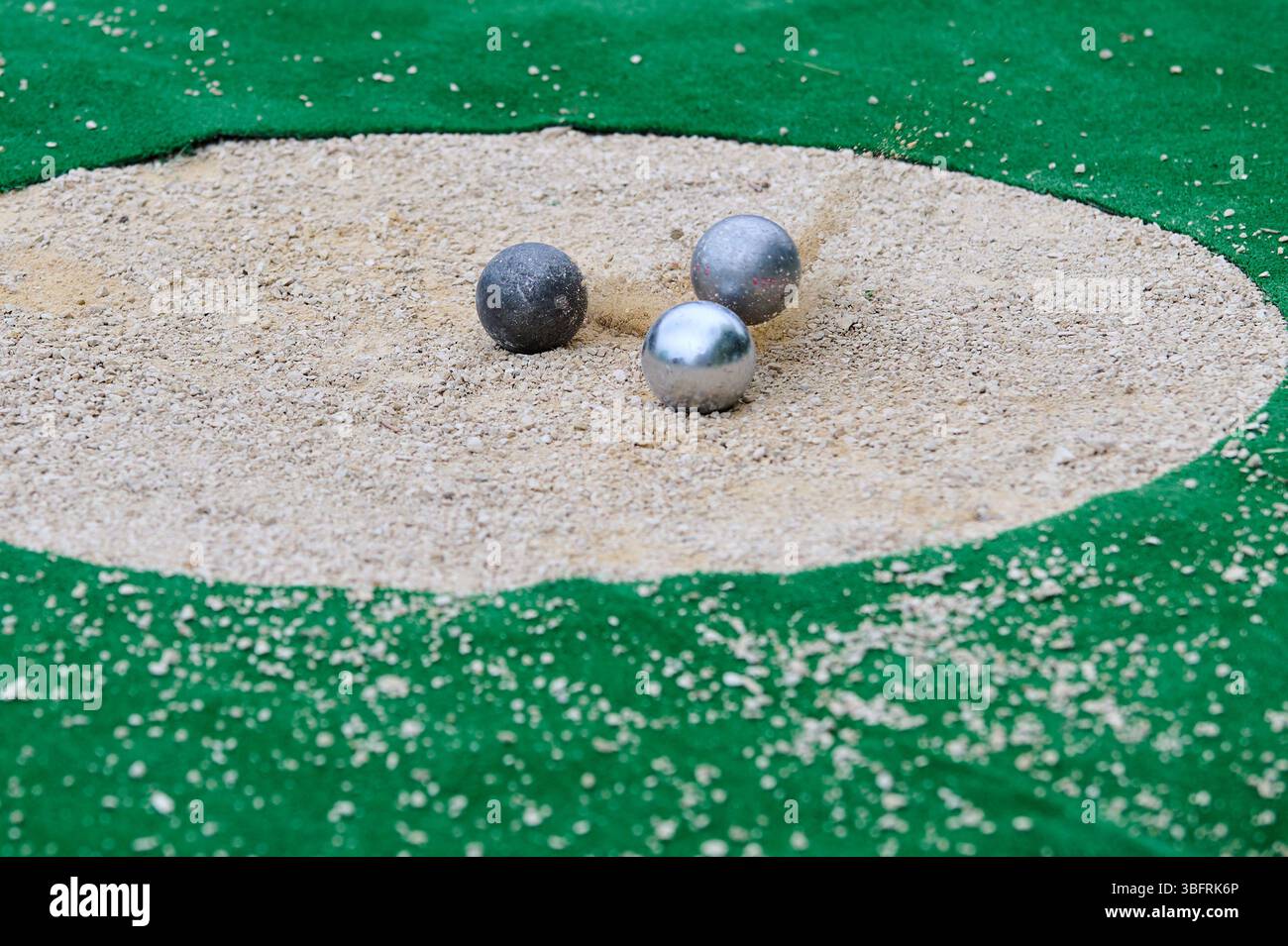 Petanque precision shooting competition moment with metal balls hitting ...