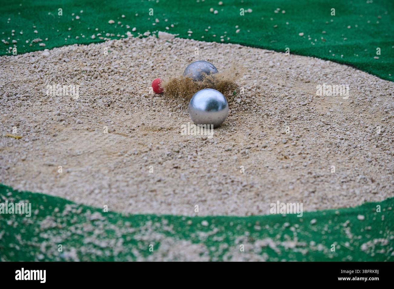 Petanque precision shooting competition moment with metal balls hitting ...