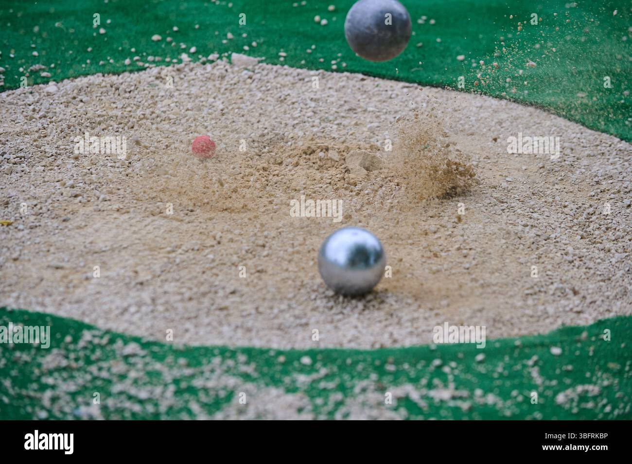 Petanque precision shooting competition moment with metal balls hitting ...