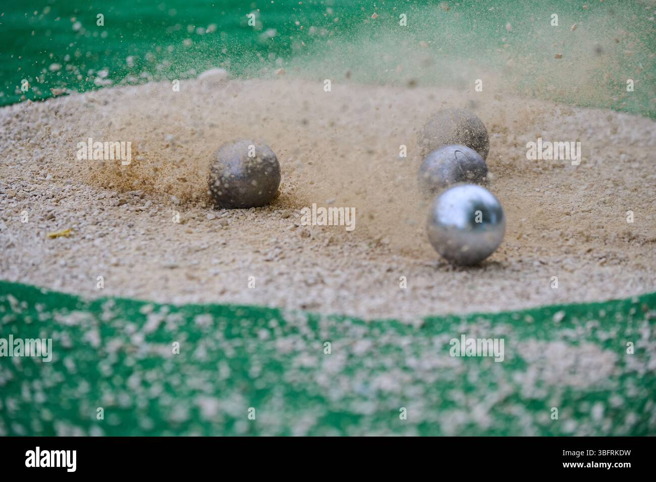 Petanque precision shooting competition moment with metal balls hitting ...