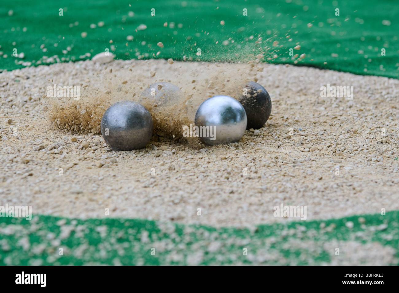 Petanque precision shooting competition moment with metal balls hitting ...