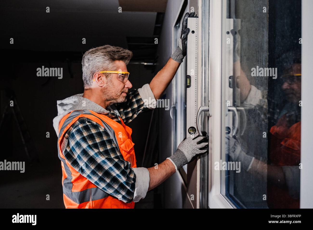 Skilled worker checks alignment hi-res stock photography and images - Alamy