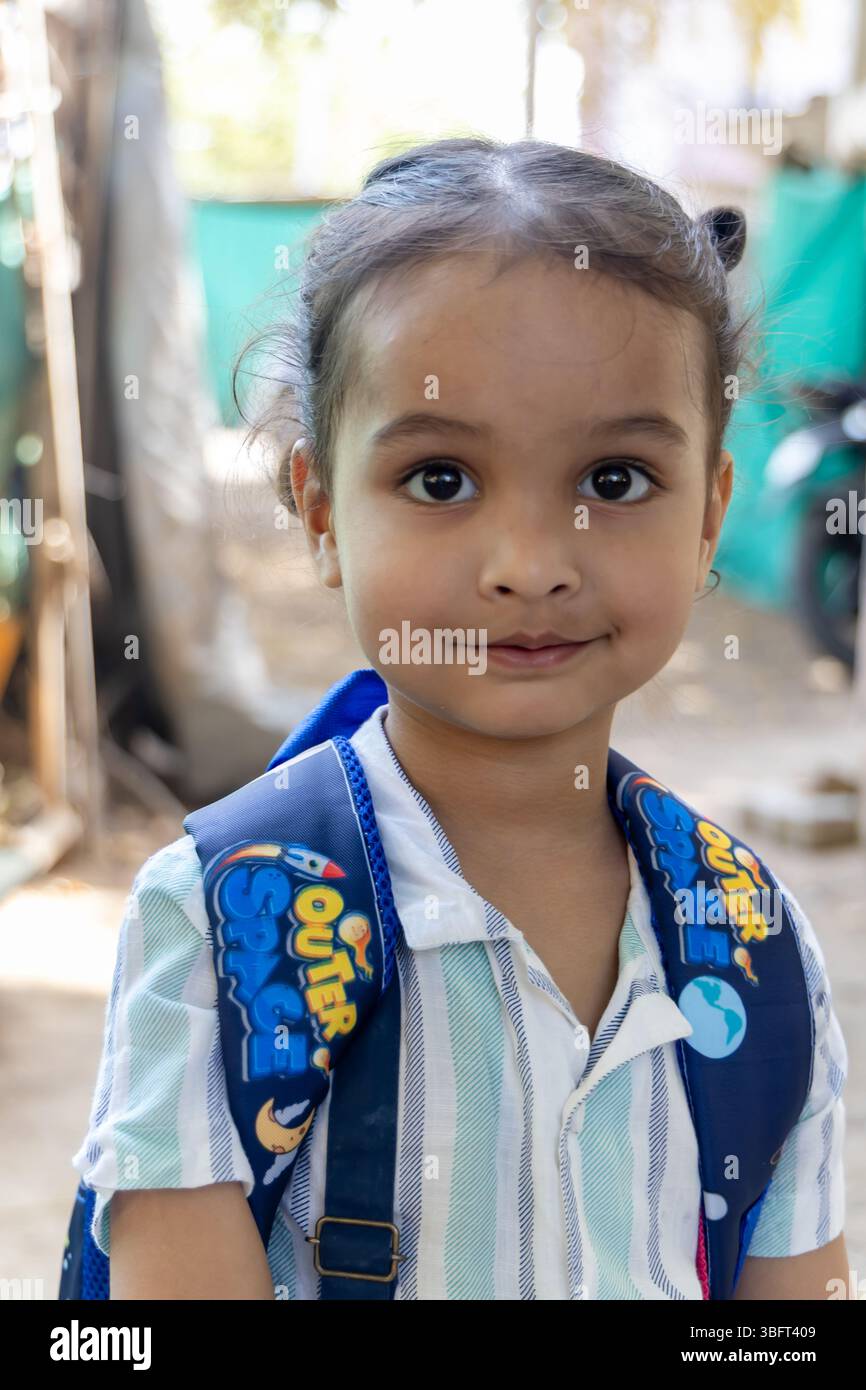 indian kid cute expression with beg for first day of school at sunny ...